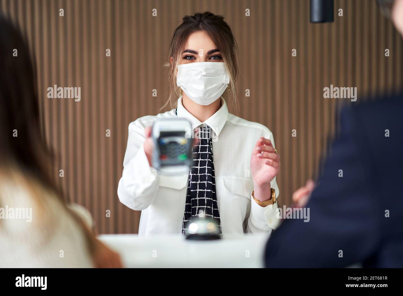 Hotel receptionist mask hi-res stock photography and images - Alamy