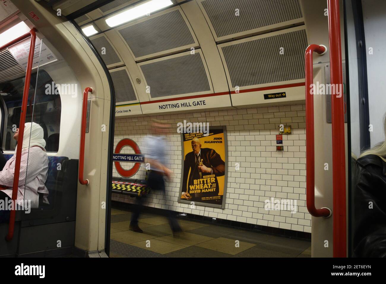 Random people at the underground tube station tfl with moving train ...