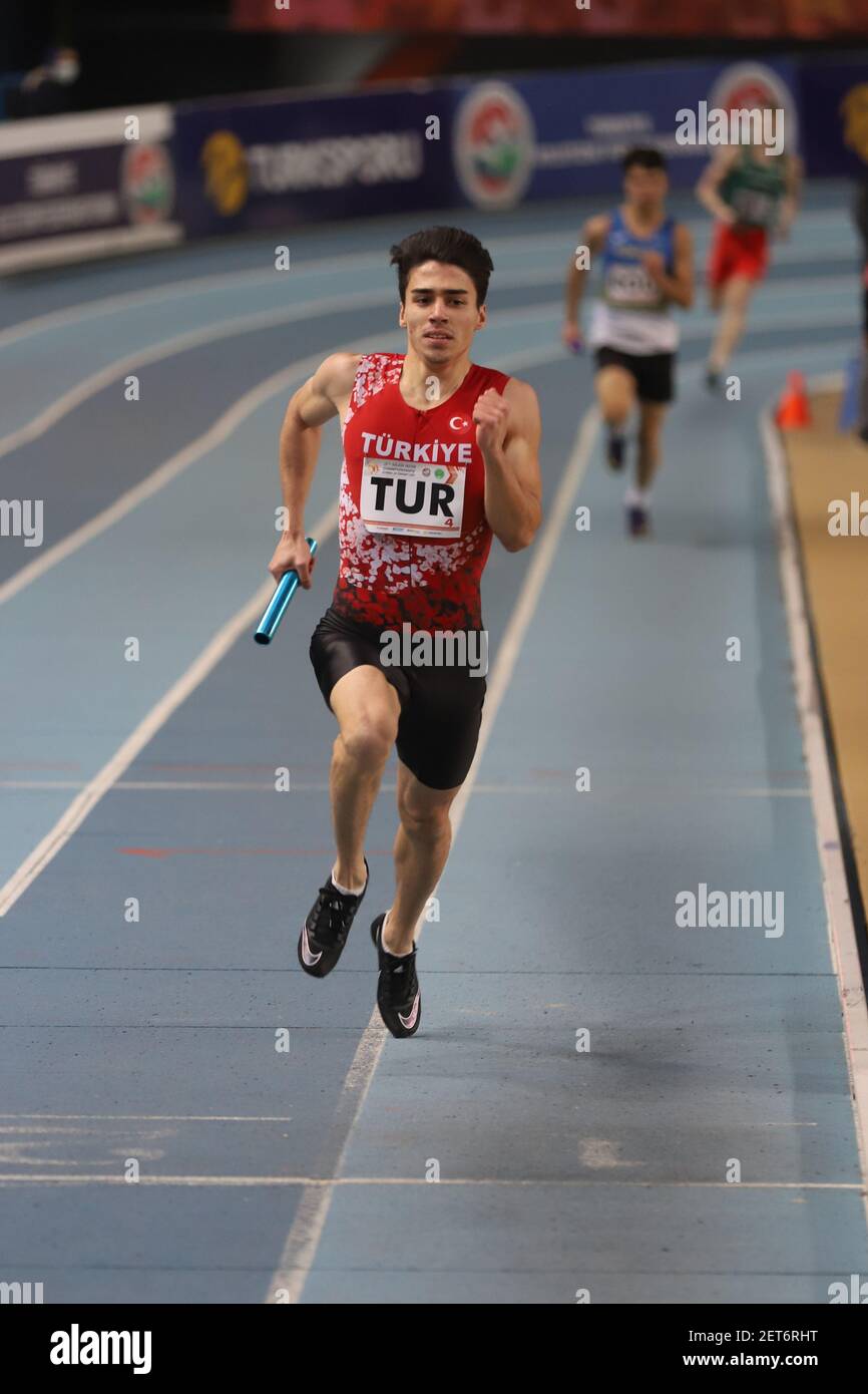 ISTANBUL, TURKEY - FEBRUARY 20, 2021: Athletes running 4x400 metres ...