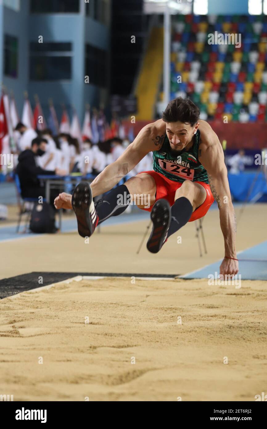 ISTANBUL, TURKEY - FEBRUARY 20, 2021: Undefined athlete long jumping ...