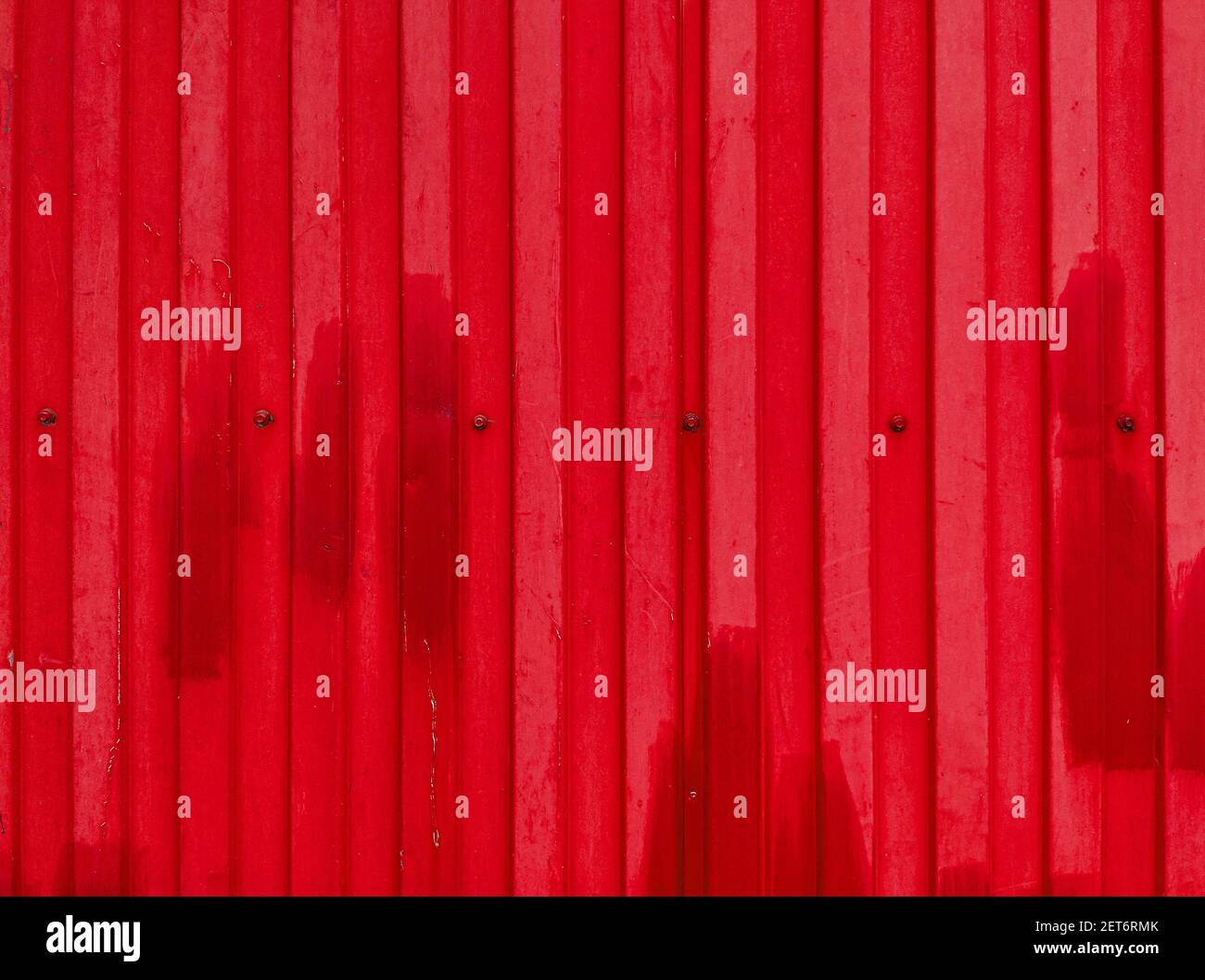 Red rippled metal texture with bolts and rivets Stock Photo - Alamy
