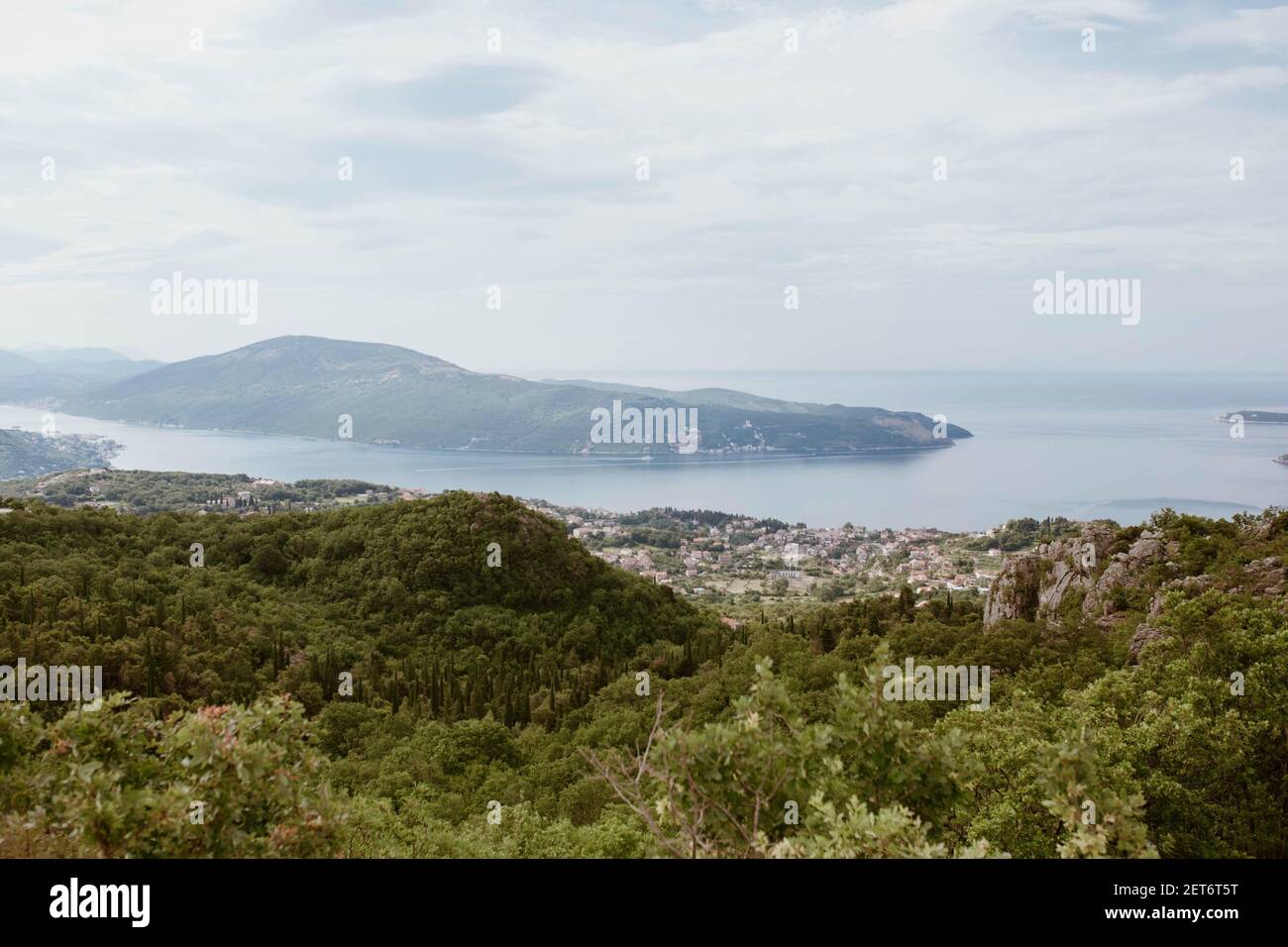 A beautiful scenery of a village seen from the top of a hill in Herceg ...