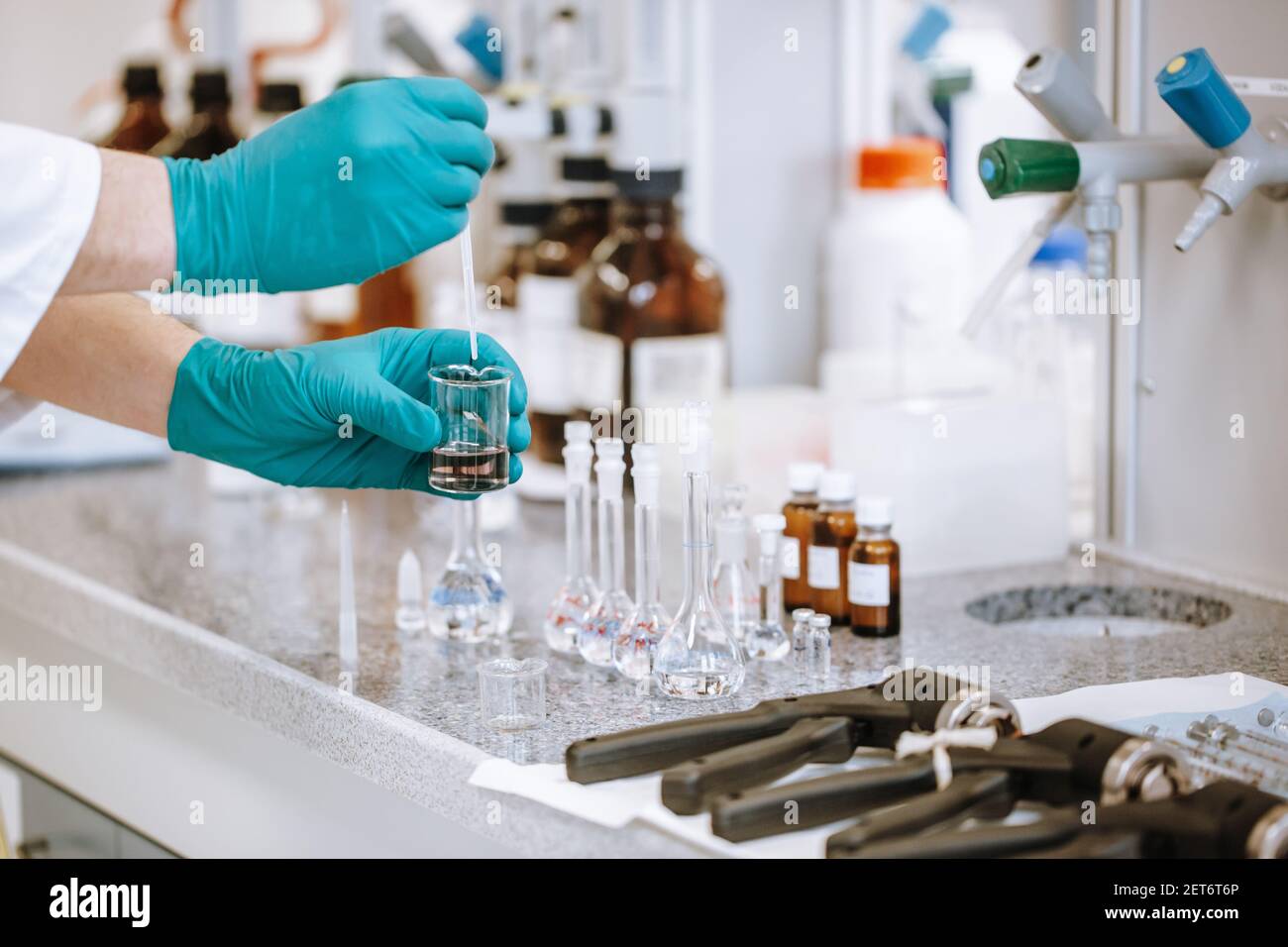 Pharmaceutist testing of a new drugs and pills in the pharmacy ...