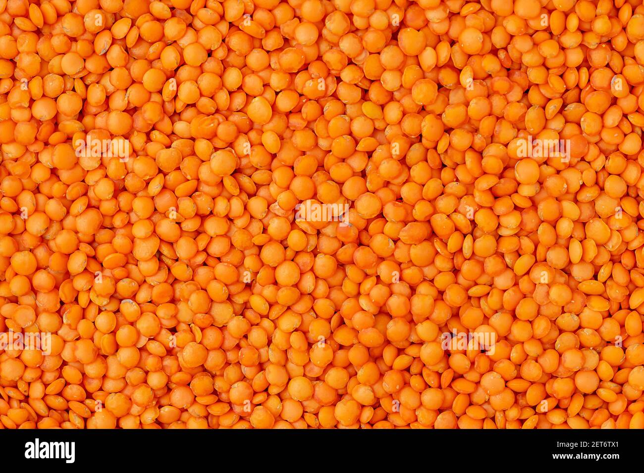 Red lentils background or texture. Closeup, top view Stock Photo - Alamy