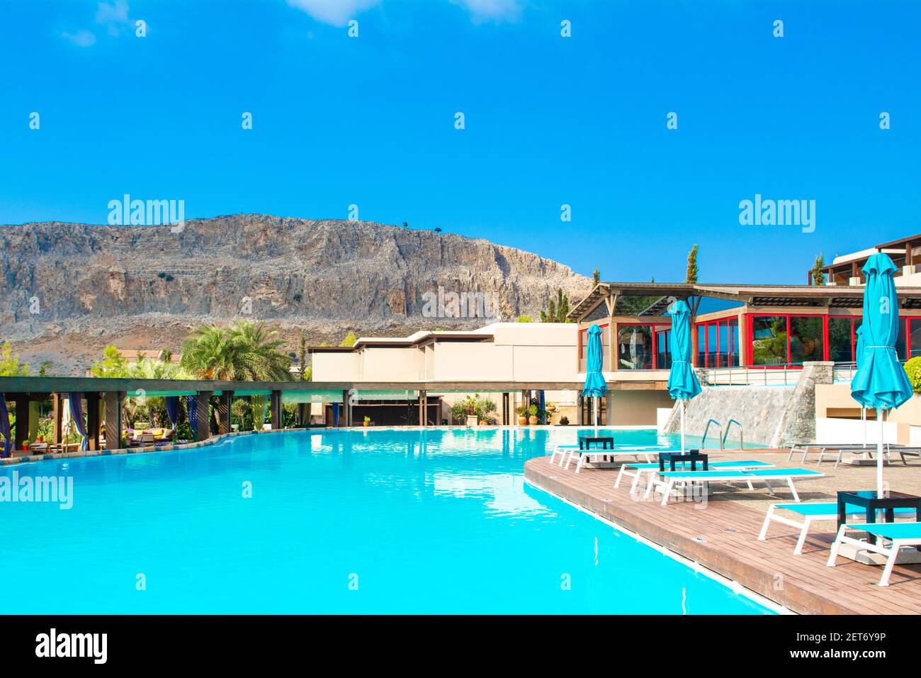 Rhodes, Greece - 18 July 2019: Outdoor pool area in a luxury hotel on ...