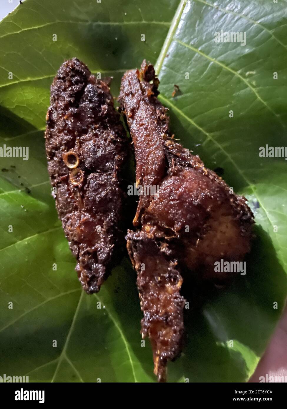 A vertical shot of delicious grilled meat on a leaf Stock Photo - Alamy