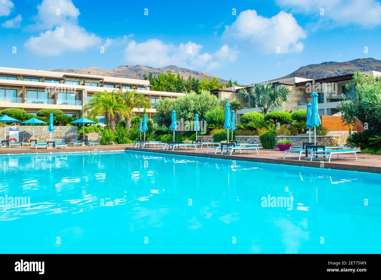 Rhodes, Greece - 18 July 2019: Outdoor pool area in a luxury hotel on ...