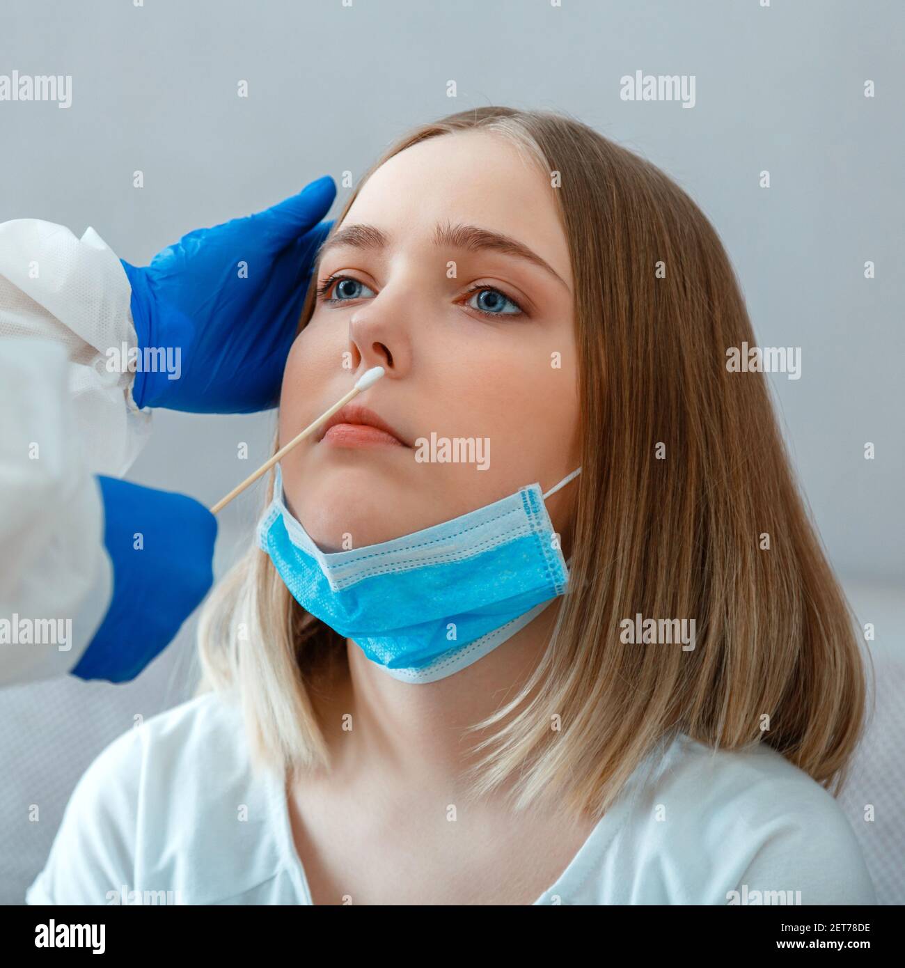 Doctor taking PCR test nasopharyngeal culture to woman patient. Nurse ...