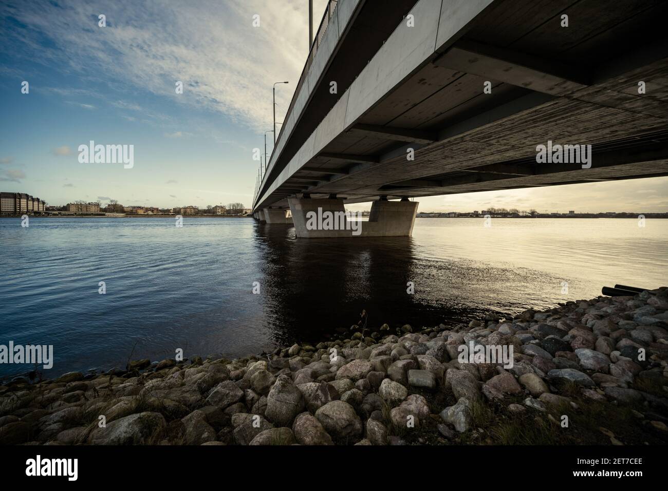 metal concrete stone bridge with rails over the river Stock Photo - Alamy