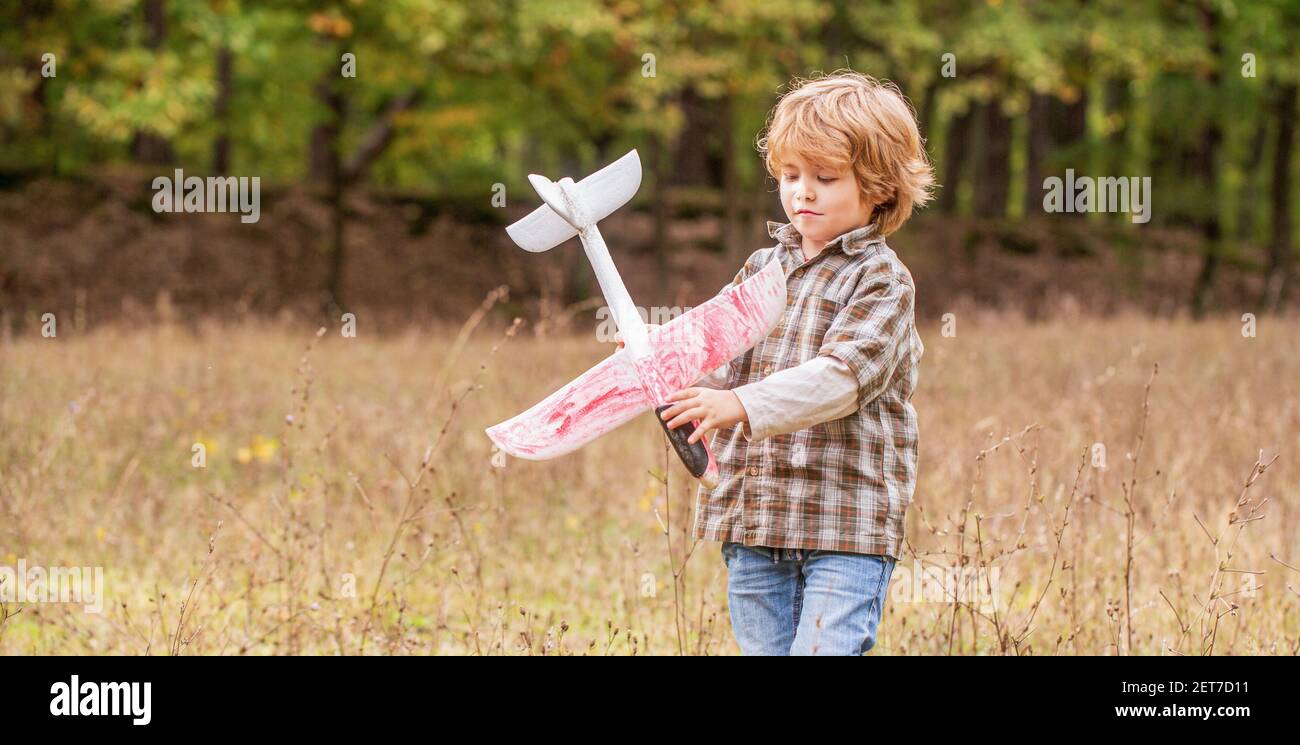 Happy boy play airplane. Little boy with plane. Little kid dreams of ...