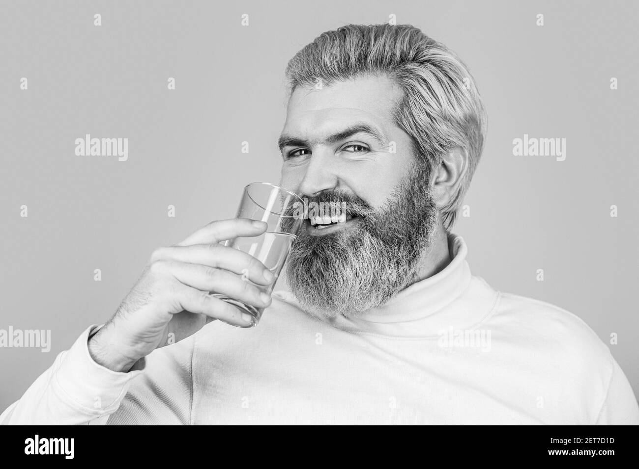 Male drinking from a glass of water. Health care concept photo ...