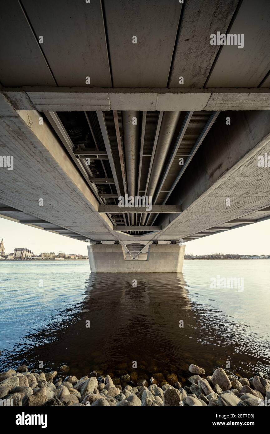 metal concrete stone bridge with rails over the river Stock Photo - Alamy