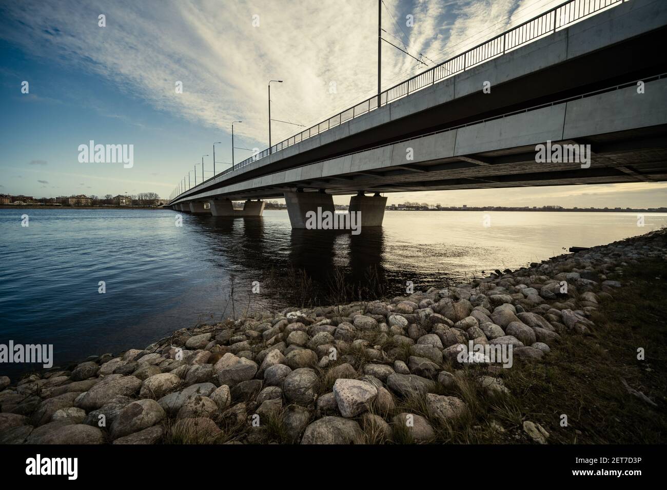 metal concrete stone bridge with rails over the river Stock Photo - Alamy