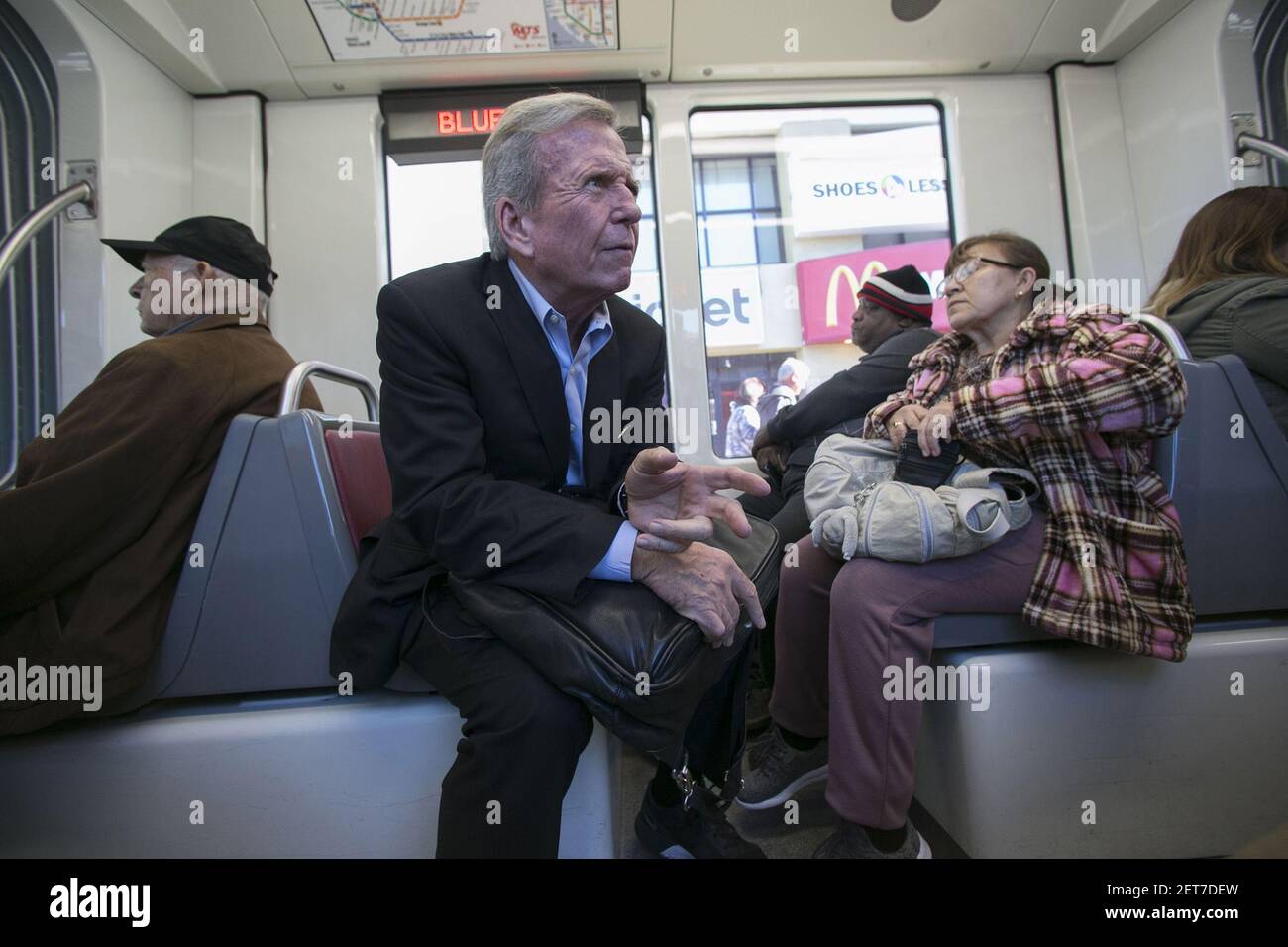 Bob Morris sits on the trolley, headed north toward downtown San Diego ...