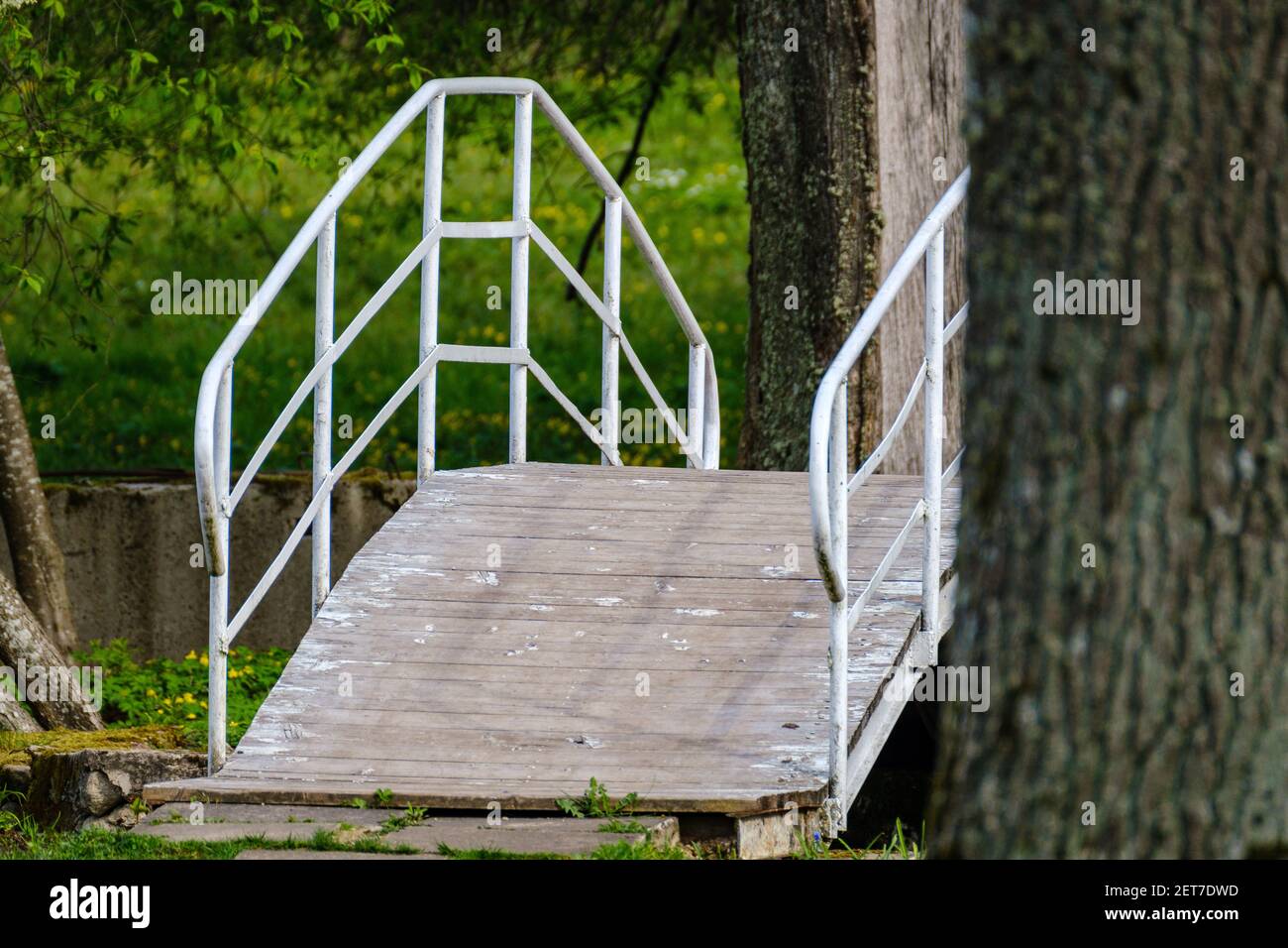 metal concrete stone bridge with rails over the river Stock Photo - Alamy