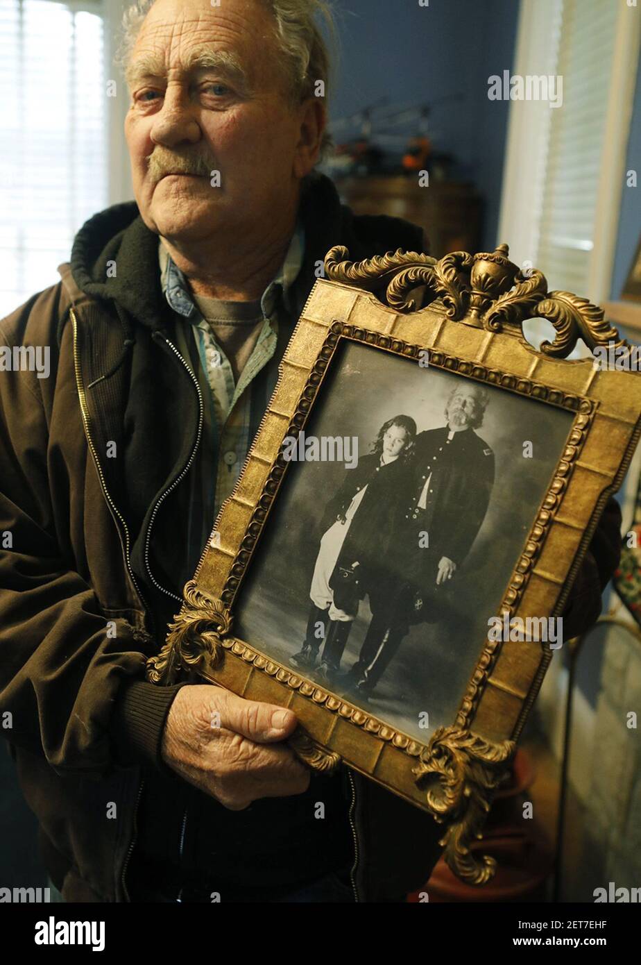 Terry Crowder shows off a picture of himself with his son, Zachary ...