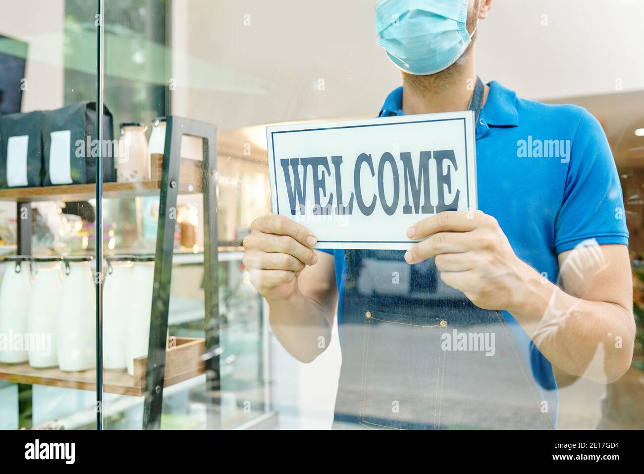 Waiter welcoming clients Stock Photo - Alamy