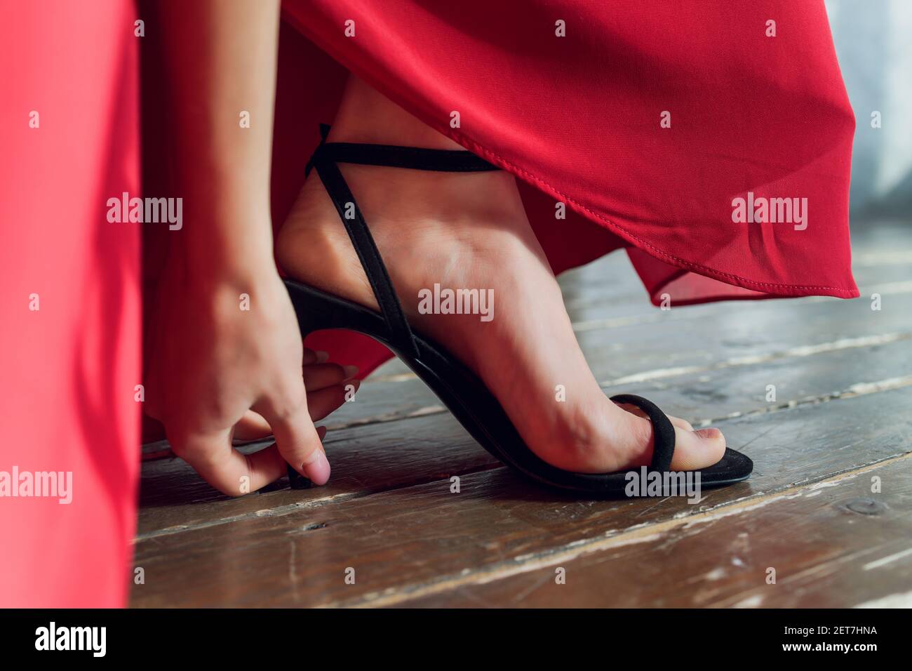 a woman's foot in a shoe got stuck in the wood floor. hole Stock Photo ...