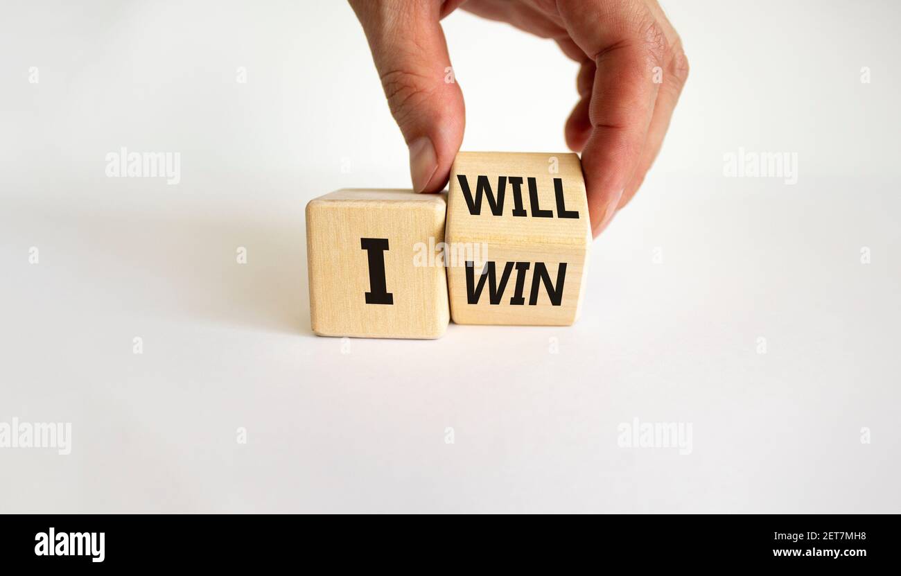 I will win symbol. Businessman turns cubes and changes words i will to ...