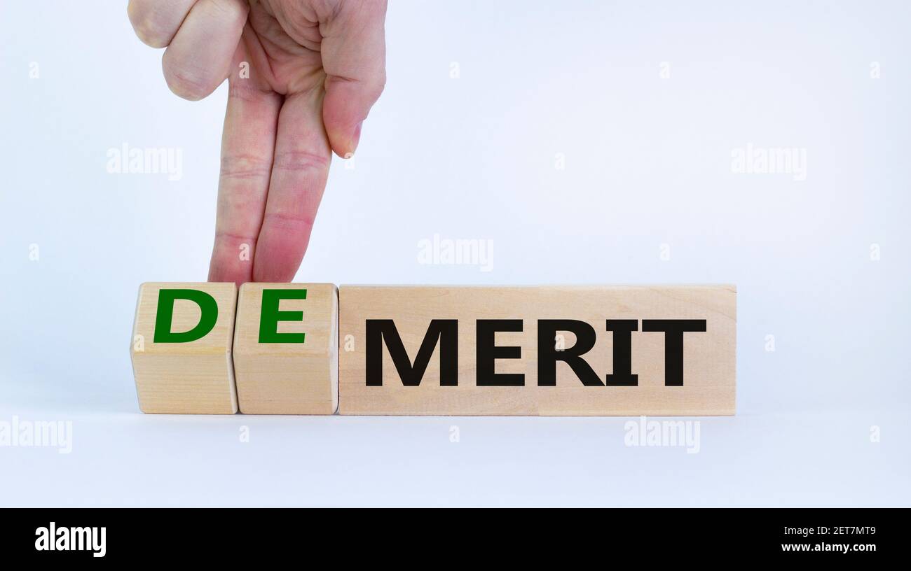 Demerit or merit symbol. Businessman turns wooden cubes and changes ...