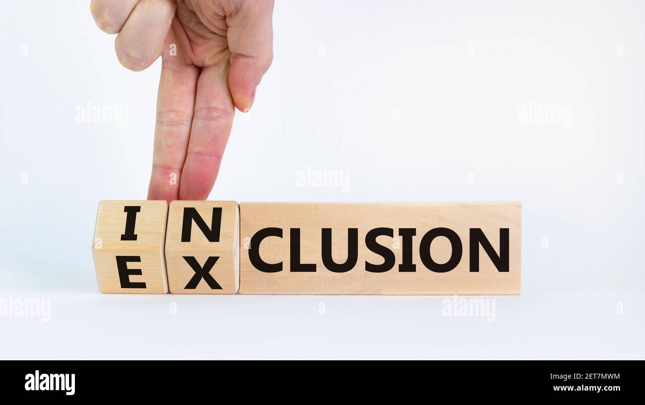 Inclusion or exclusion symbol. Businessman turns wooden cubes and ...