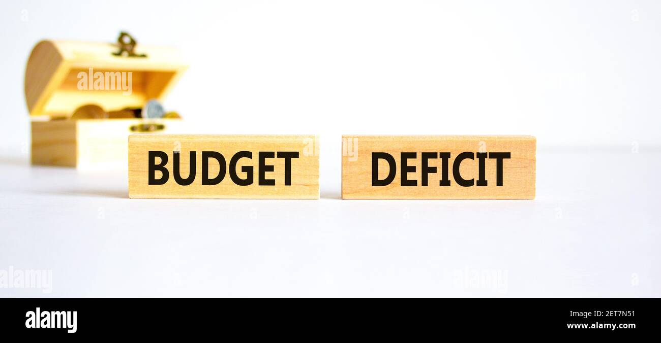 Budget deficit symbol. Concept words 'budget deficit' on wooden blocks ...