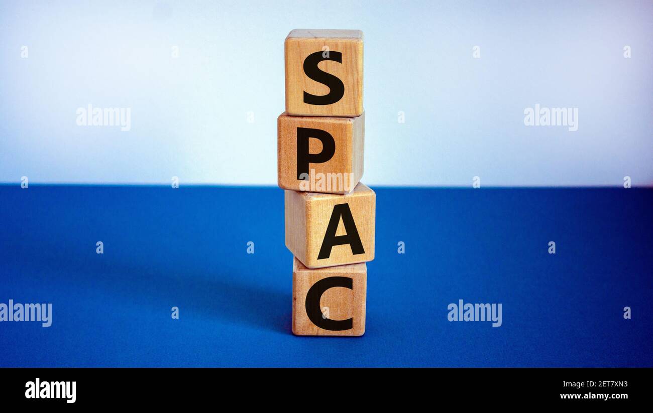SPAC, special purpose acquisition company symbol. Wooden cubes with ...