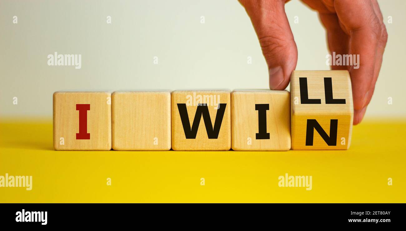 I will win symbol. Businessman turns cubes and changes words i will to ...