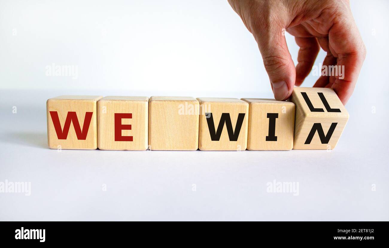 We will win symbol. Businessman turns cubes and changes words we will ...