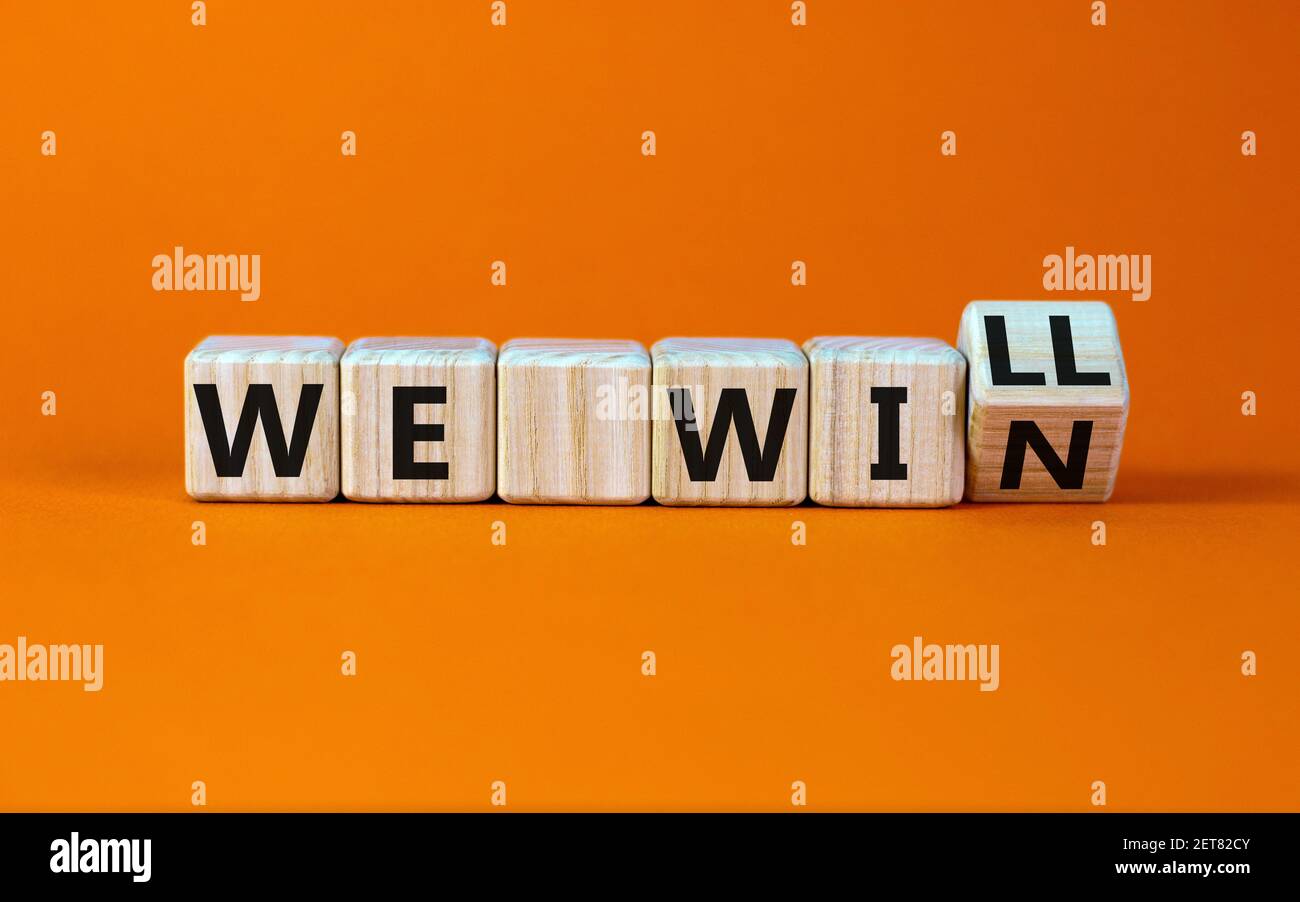 We will win symbol. Turned a wooden cube and changed words we will to ...