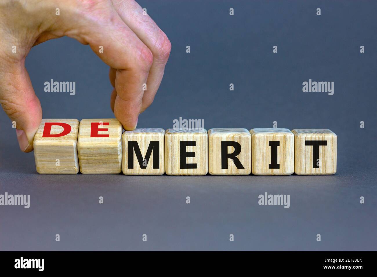 Demerit or merit symbol. Businessman turns wooden cubes and changes ...