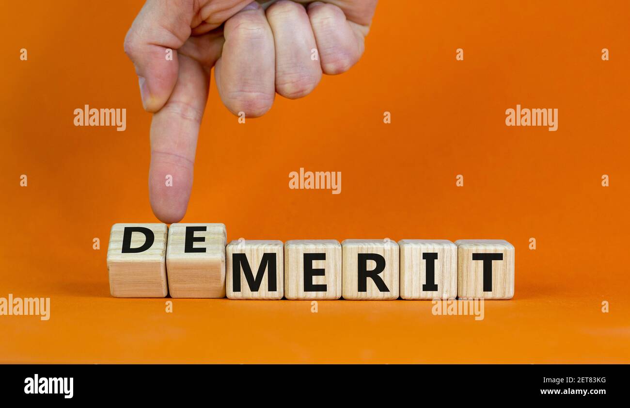 Demerit or merit symbol. Businessman turns wooden cubes and changes ...