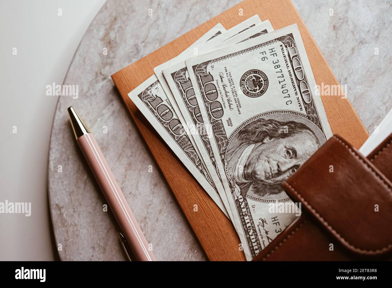 Money on home office desk, american dollars closeup Stock Photo - Alamy
