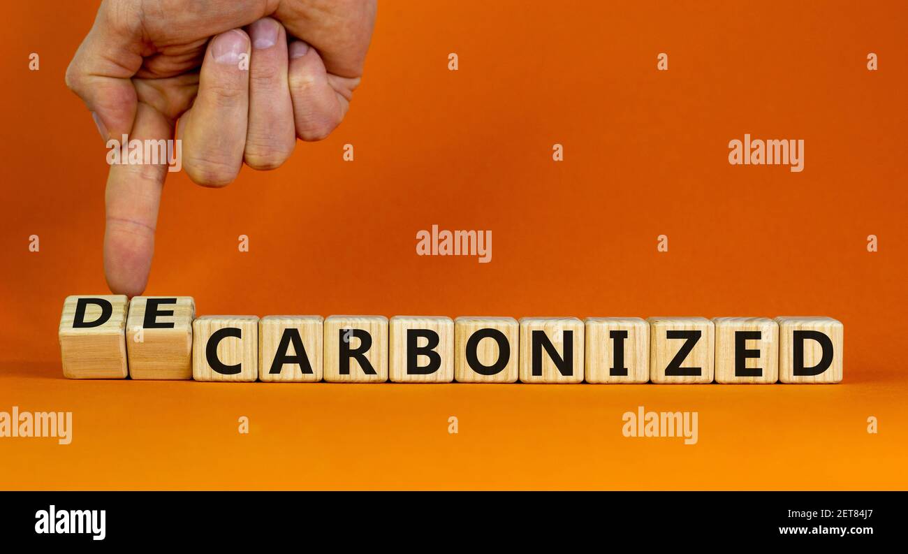 Carbonized or decarbonized symbol. Businessman turns wooden cubes and ...