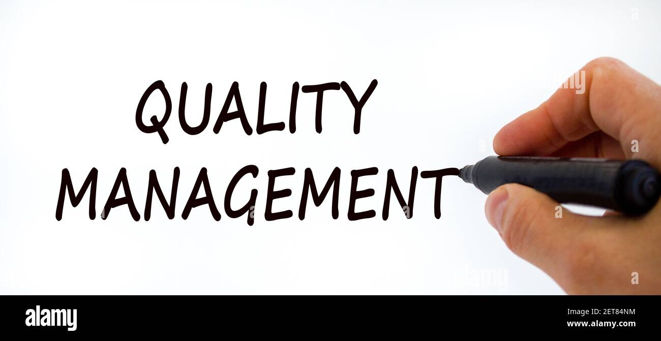 Quality management symbol. Businessman writing words 'Quality ...