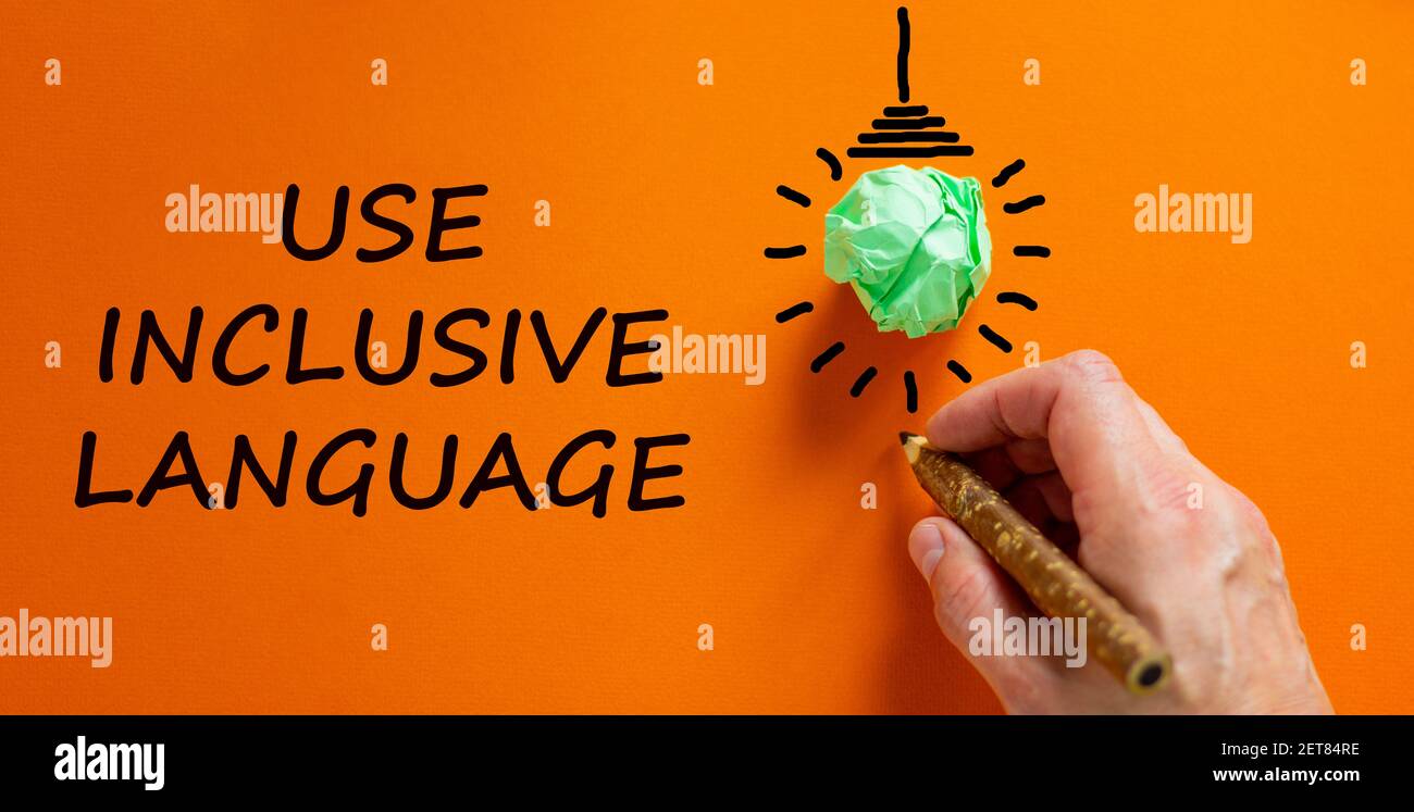 Use inclusive language symbol. Businessman writing words 'Use inclusive ...