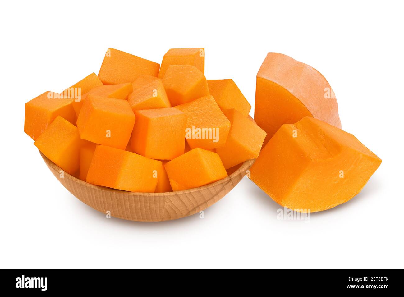 butternut squash diced in wooden bowl isolated on white background with ...