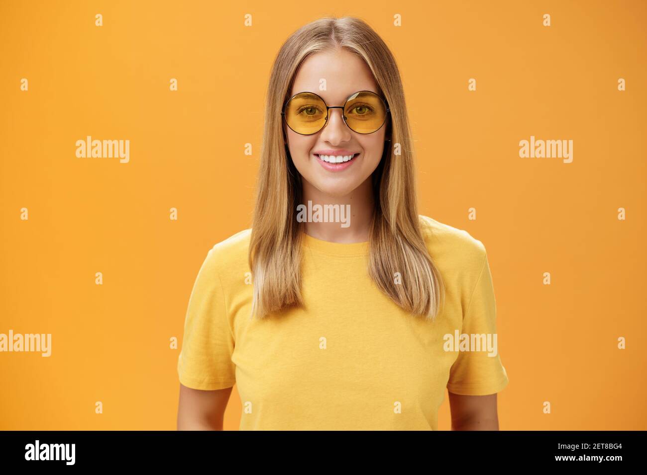 Stylish self-assured charming european woman with fair hair and tanned ...