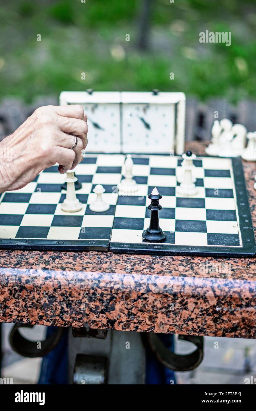 Friends having fun playing chess hi-res stock photography and images ...