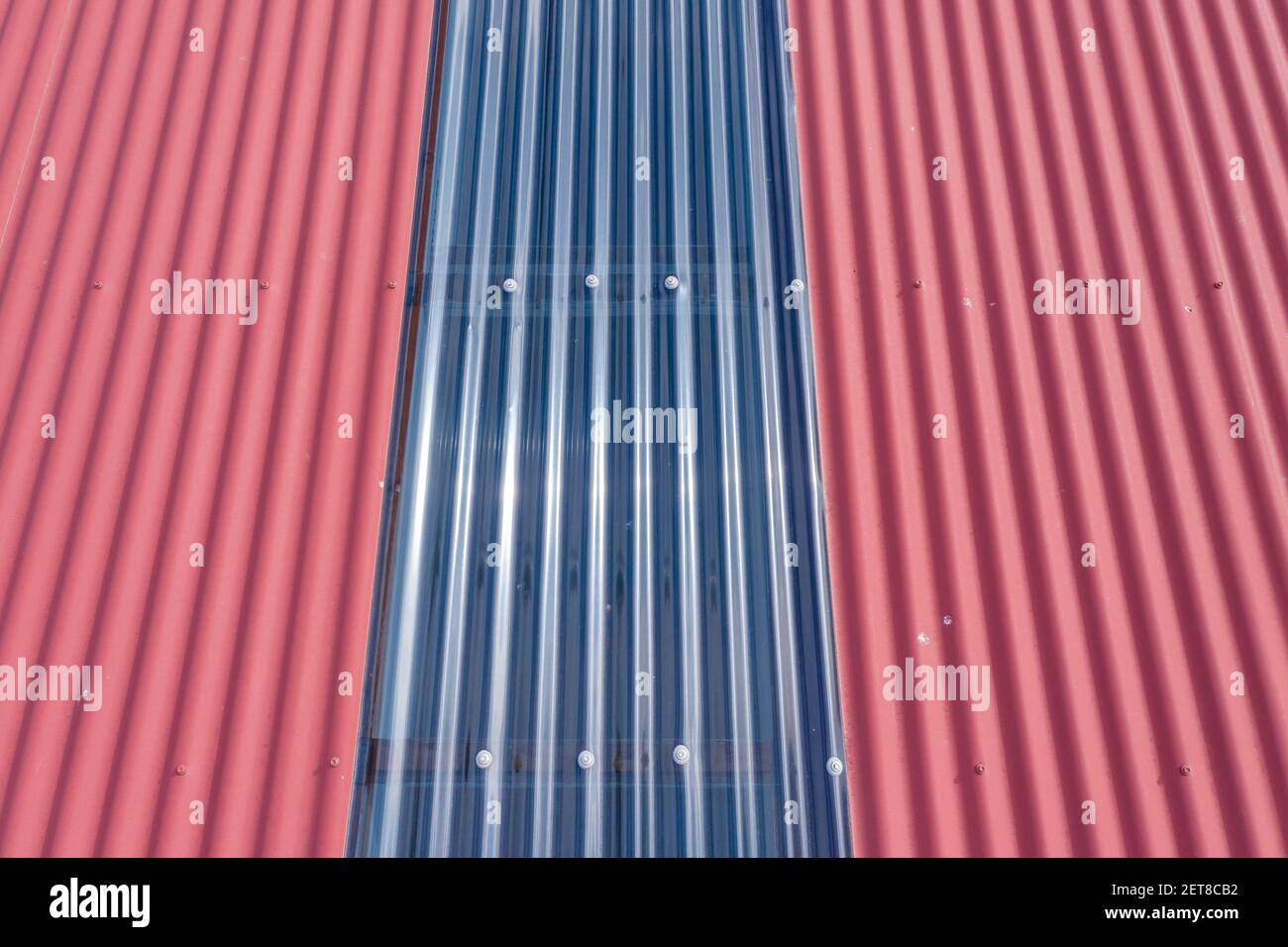 Aerial view of burgundy coloured corrugated iron and perspex roof ...