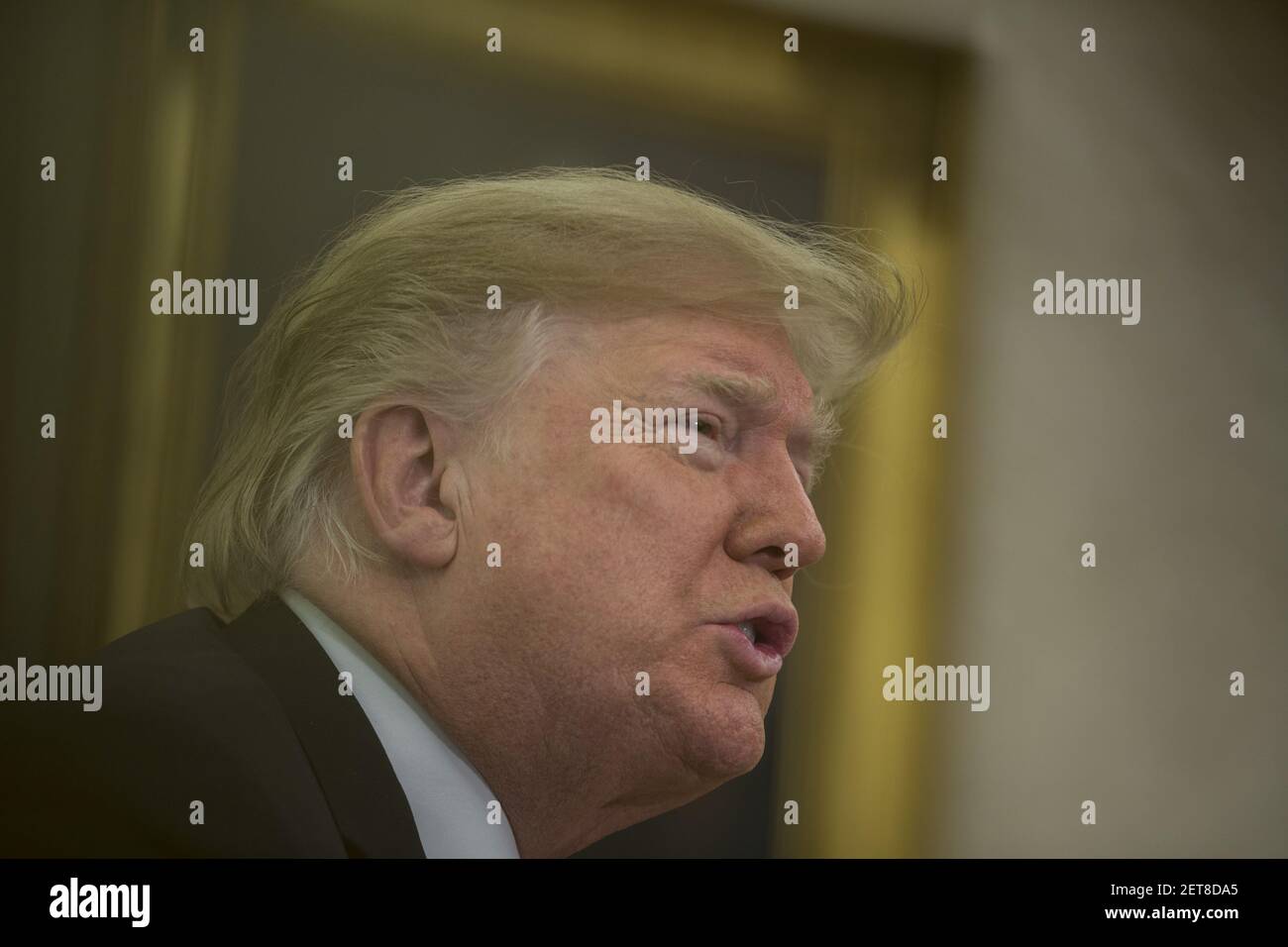 President Donald Trump answers questions from members of the press ...