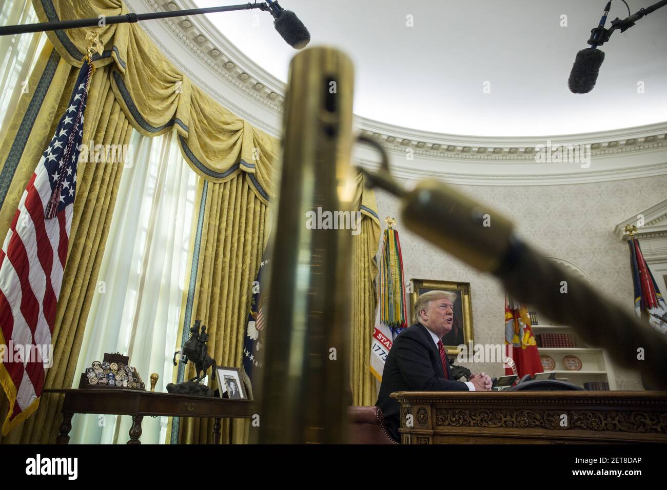 President Donald Trump answers questions from members of the press ...