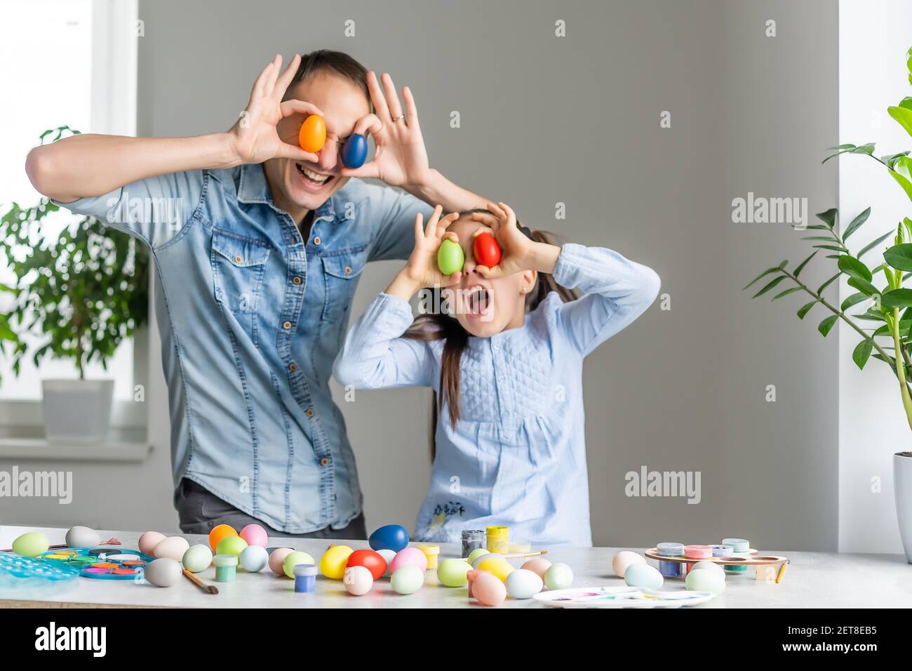 Father and daughter with colorful Easter eggs Stock Photo - Alamy