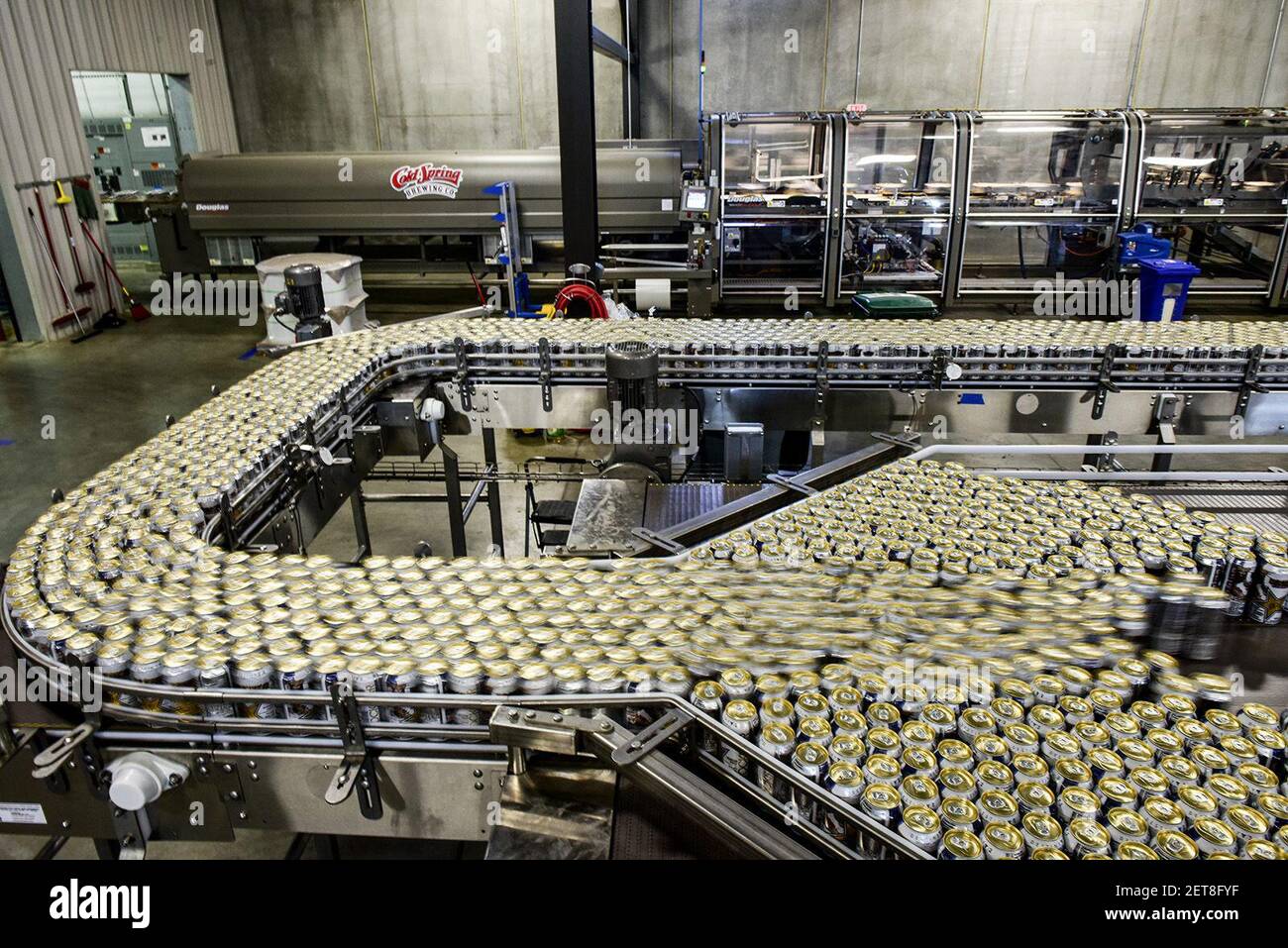 Thousands of cans of Rockstar energy drink moved along the production ...