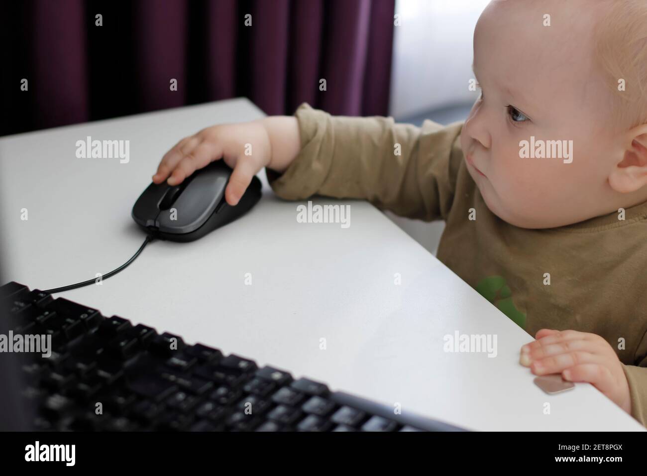 Little boy with light work on the computer Stock Photo - Alamy