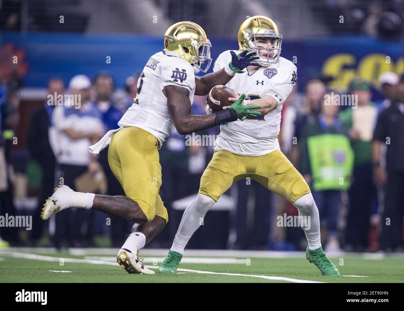 December 29, 2018: Notre Dame quarterback Ian Book (12) hands the ball ...