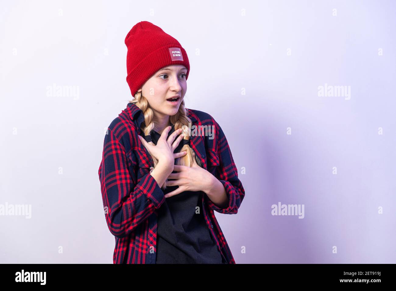 girl in red cap to press her hands to the crudy and marvel at the light ...