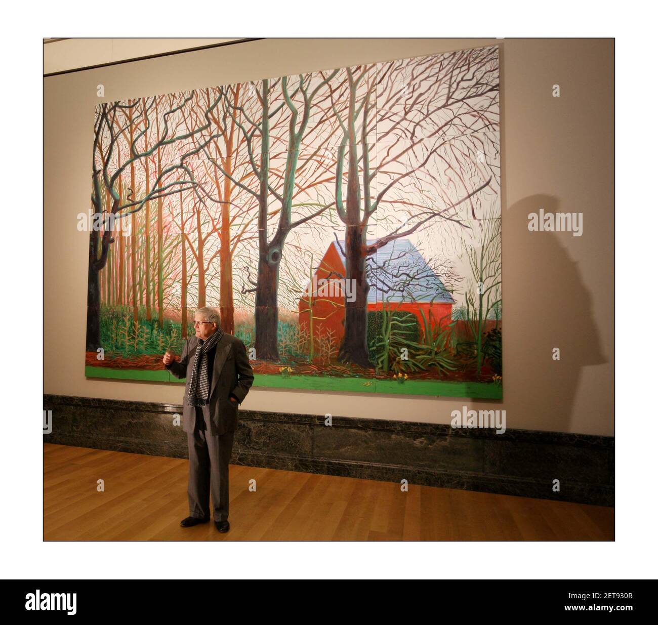 British artist David Hockney (L) poses for photographs next to a ...