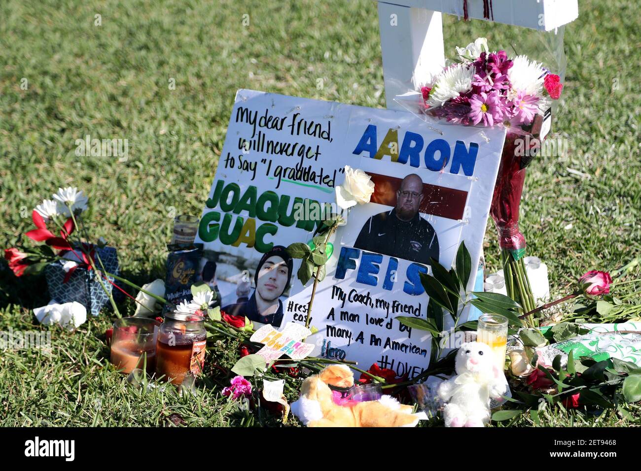 A tribute to student Joaquin Oliver and Coach Aaron Feis is left at the ...
