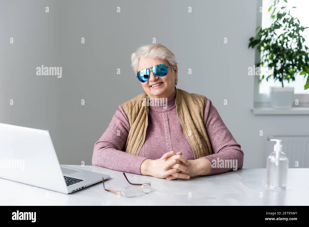 Progressive modern granny concept. Smiling elderly woman blogger Stock ...